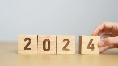 hand holding 2024 year block on table. g... | Stock Video | Pond5