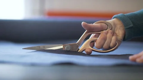 Hand holding big scissors and making cut... | Stock Video | Pond5