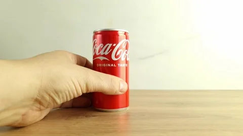 Hand holding can of Coca-Cola beverage | Stock Video | Pond5