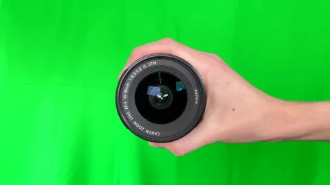 Hand holding Canon camera lens on chroma... | Stock Video | Pond5