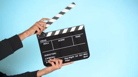 Hand is holding clapper board or clapper... | Stock Video | Pond5