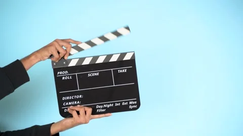 Hand is holding clapper board or clapper... | Stock Video | Pond5