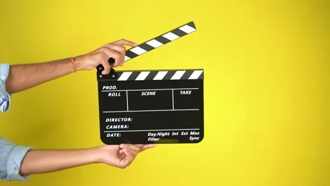 Hand is holding clapper board or clapper... | Stock Video | Pond5