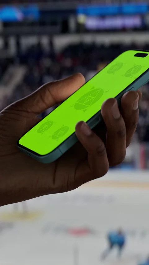 A hand holding a phone with a green scre... | Stock Video | Pond5