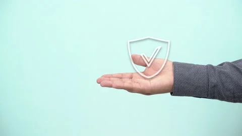 hand holding protect shield with a check... | Stock Video | Pond5