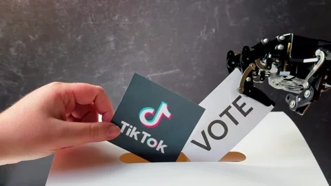 Hand Holding TikTok and Vote Cards with ... | Stock Video | Pond5
