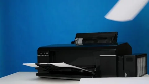 A hand inserts blank sheets of A4 paper ... | Stock Video | Pond5