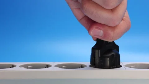 Hand Inserts The Plug Into The Socket Of... | Stock Video | Pond5