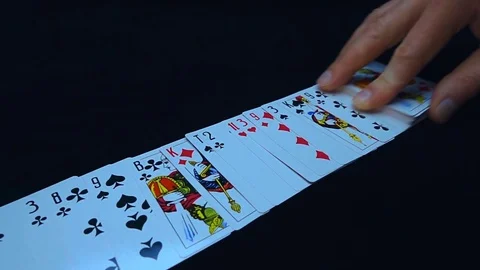 Hand lay out playing cards on a white ba... | Stock Video | Pond5