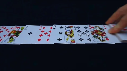 Hand lay out playing cards on a white ba... | Stock Video | Pond5