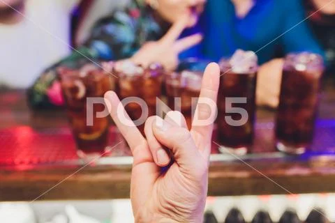 A Hand making a Sign of the horns aka devil sign aka maloik. Stock ...