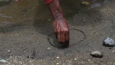 A Hand Making Smile Emoticon Above a San... | Stock Video | Pond5