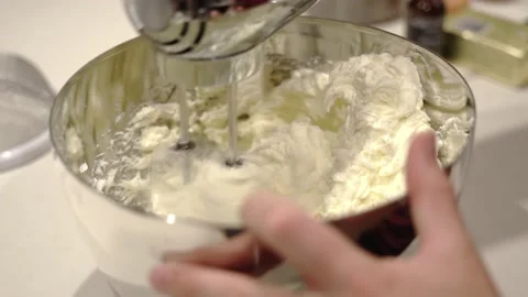 Hand mixer mixes cheesecake batter in mi... | Stock Video | Pond5