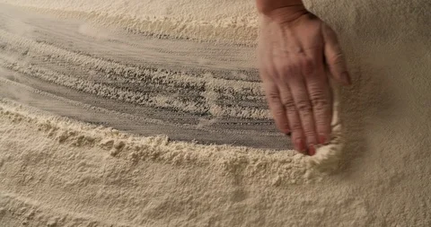 Hand moving on table of Flour 4K food ba... | Stock Video | Pond5