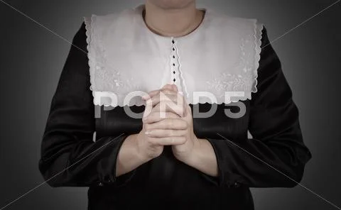 Hand of nun praying Stock Illustration ~ Graphic #42538168