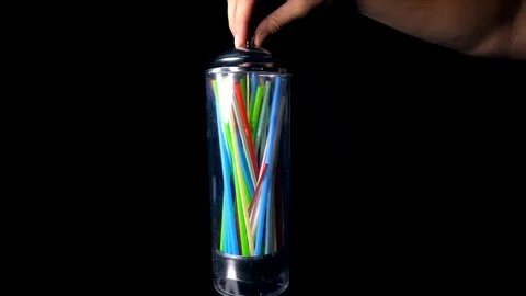 hand opening and closing a colorful stra... | Stock Video | Pond5