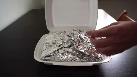 Hand packing take-away cooked meat in w... | Stock Video | Pond5