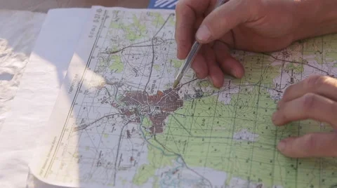 Hand with a pen on the map showing desti... | Stock Video | Pond5