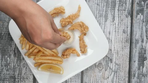 hand pick Fish fillet , chips and potato... | Stock Video | Pond5