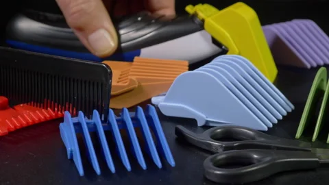 Hand placing a hair clipper tool next to... | Stock Video | Pond5