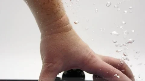Hand plunging into water grabbing a hand... | Stock Video | Pond5