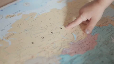 Hand Pointing at Russia on a Blurry and ... | Stock Video | Pond5