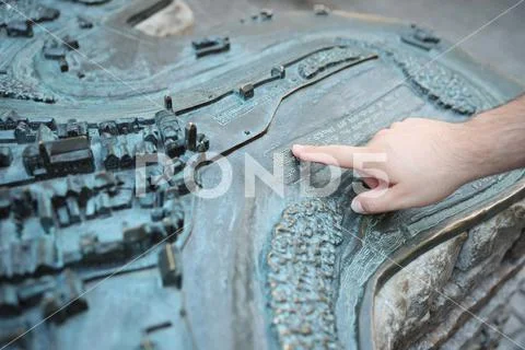 Hand points on city map with braille letters blind alphabet braille ...