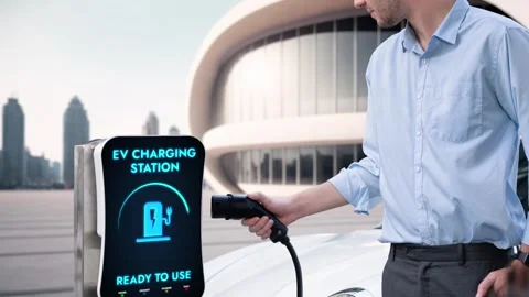 Hand pull EV charger from smart electric... | Stock Video | Pond5