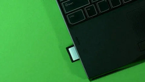 Hand Pulling Out Memory Card From Laptop... | Stock Video | Pond5