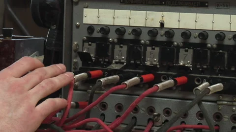 A hand putting a plug into a switchboard | Stock Video | Pond5