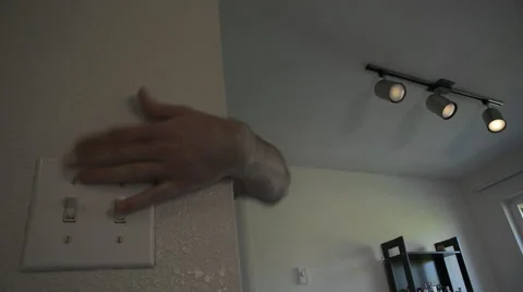 Hand reaching around a corner to flick s... | Stock Video | Pond5