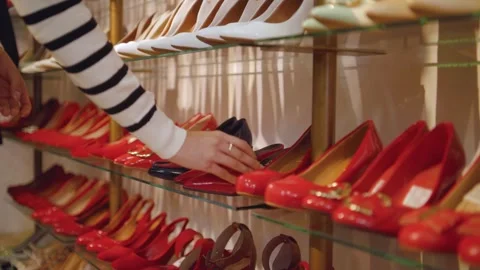Hand Reaching for Red High Heels in a Sh... | Stock Video | Pond5