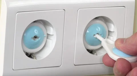 Hand remove safety plug from electricity... | Stock Video | Pond5