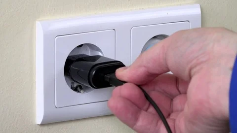 Hand remove safety plug from electricity... | Stock Video | Pond5