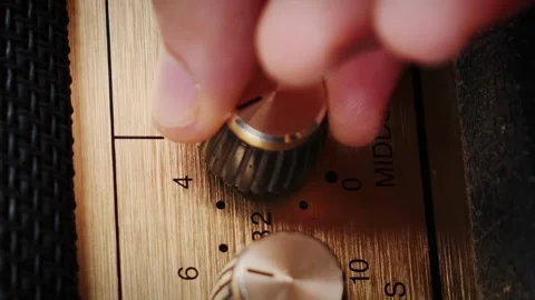 Hand rotating knob on guitar amplifier t... | Stock Video | Pond5