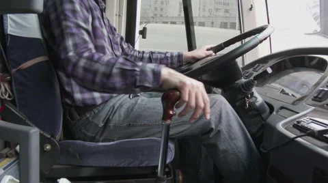 Hand shifts gear in a bus, then camera t... | Stock Video | Pond5