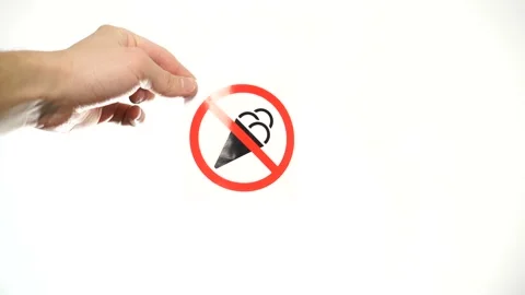 Hand showing warning sign "No ice cream"... | Stock Video | Pond5