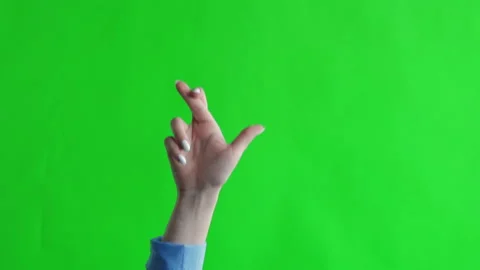 Hand shows gesture fingers crossed. Gree... | Stock Video | Pond5