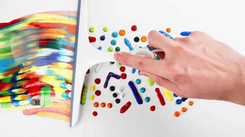 Hand smears mixing colorful paint drople... | Stock Video | Pond5