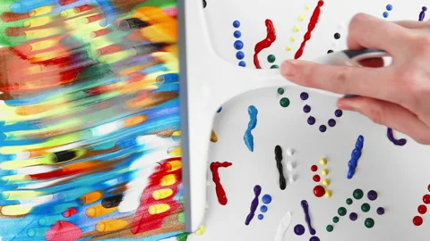 Hand smears mixing paint droplets on whi... | Stock Video | Pond5