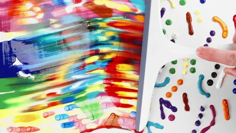 Hand smears mixing paint droplets on whi... | Stock Video | Pond5