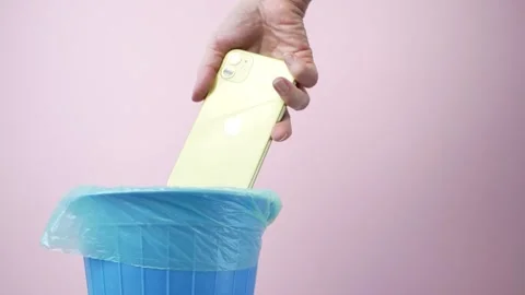 Hand throwing mobile phone away, trash b... | Stock Video | Pond5