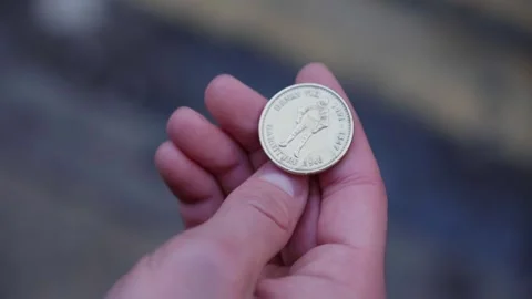 Hand tossing a coin. Throwing silver coi... | Stock Video | Pond5
