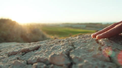 Hand Touching Cracked Dry Ground | Stock Video | Pond5