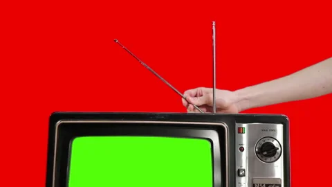 Hand tuning the Antenna of an Old TV wit... | Stock Video | Pond5
