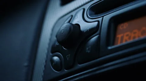 Hand turning off a car radio system | Stock Video | Pond5