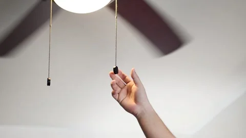 Hand turning off the light of fan ceilin... | Stock Video | Pond5