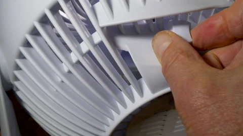 Hand turning on a room fan to the highte... | Stock Video | Pond5
