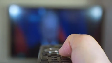 Hand turns off the TV by remote control.... | Stock Video | Pond5
