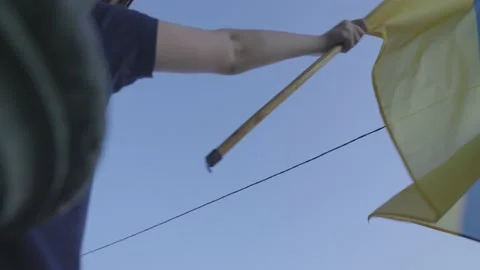 hand waving Ukrainian flag in slow motio... | Stock Video | Pond5